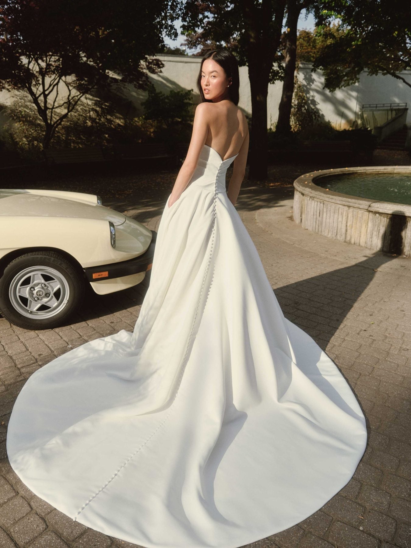 Chic and Architectural A-Line Wedding Dress With Buttons | Kleinfeld Bridal